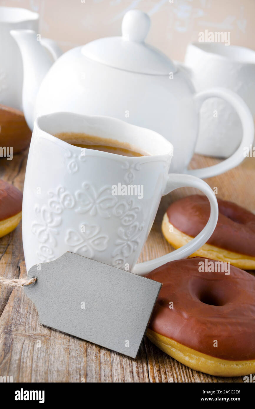 Coffee and donuts with label Stock Photo - Alamy