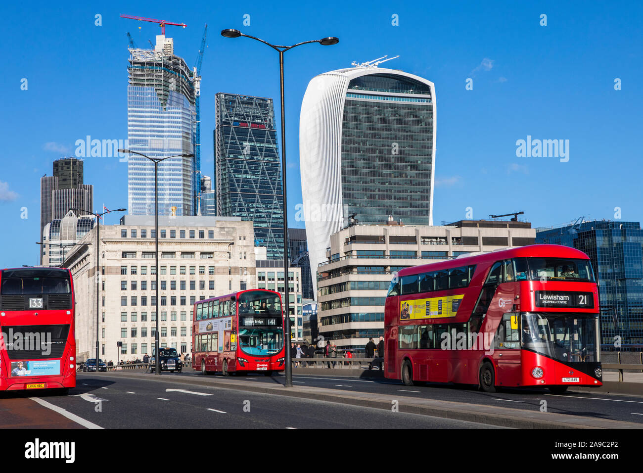 London, UK - January 28th 2019: Three red London buses crossing the ...