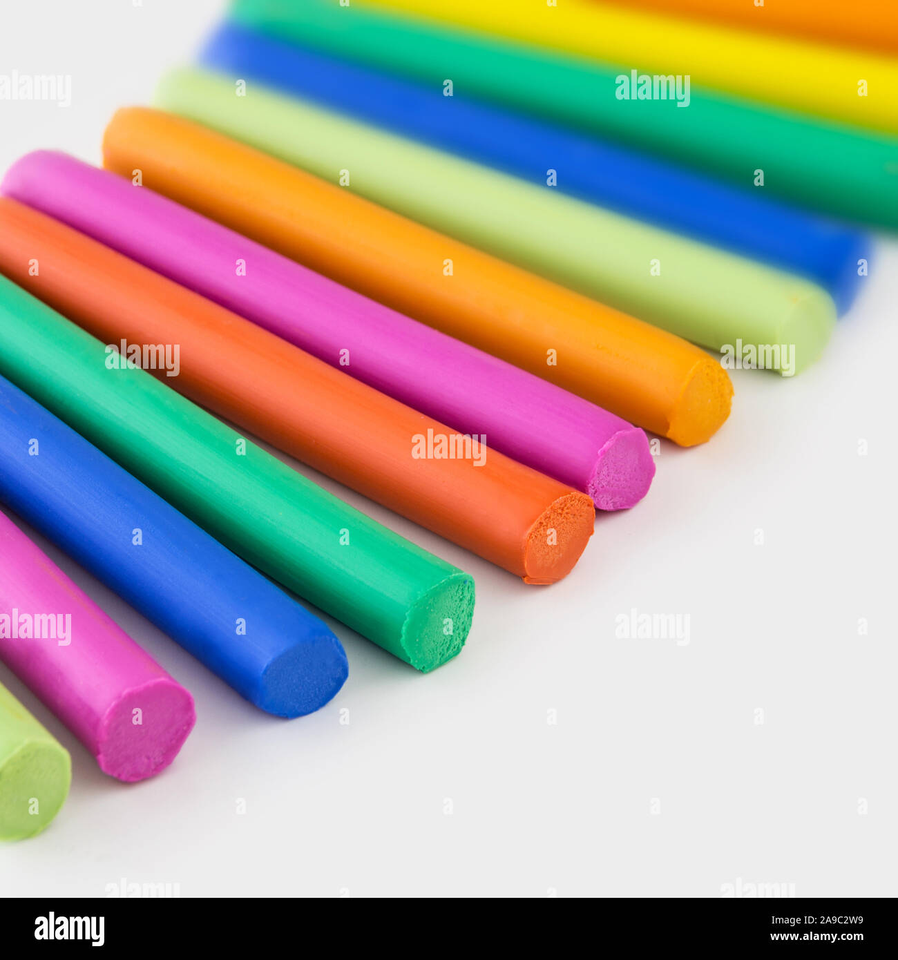 Modeling clay on white background Stock Photo - Alamy