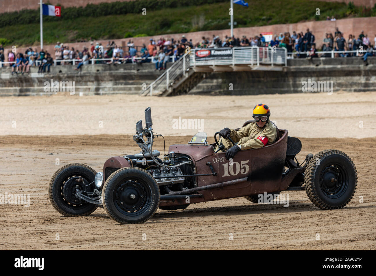 A vintage Ford hot rod at the "Race the Waves" event, where cars and ...
