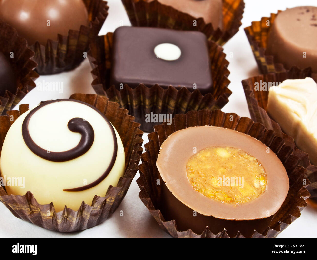 Mix of chocolate pralines close up Stock Photo - Alamy