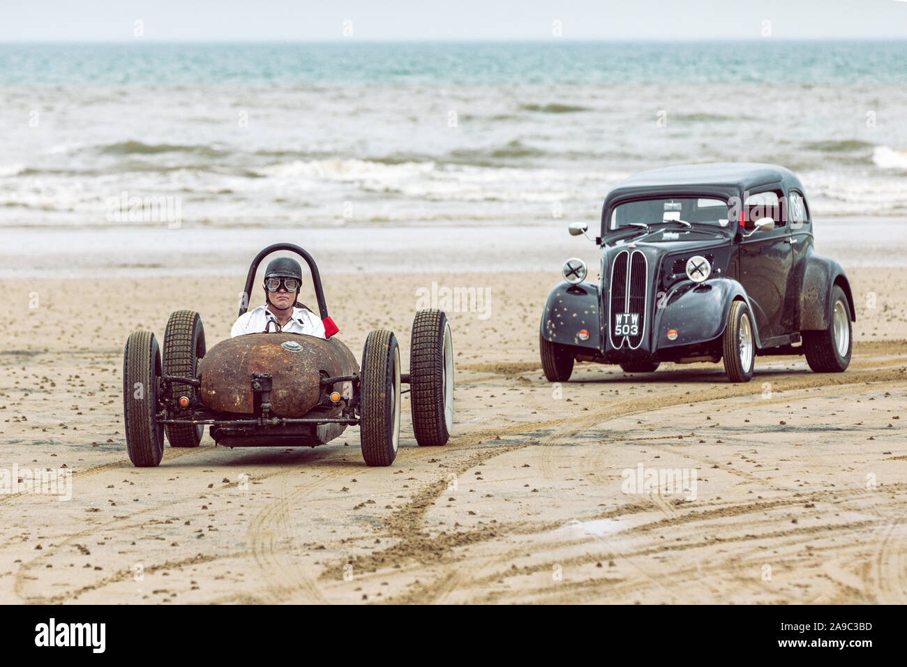 Two vintage hot rods at the "Race the Waves" event, where cars and ...