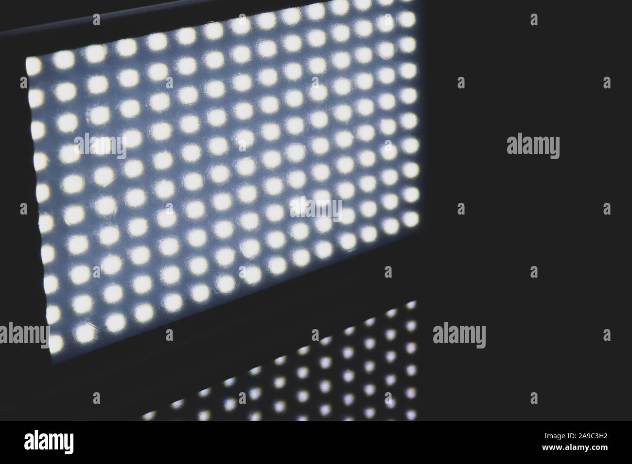 Many LED lights covered with scratched transparent matte filter reflect ...