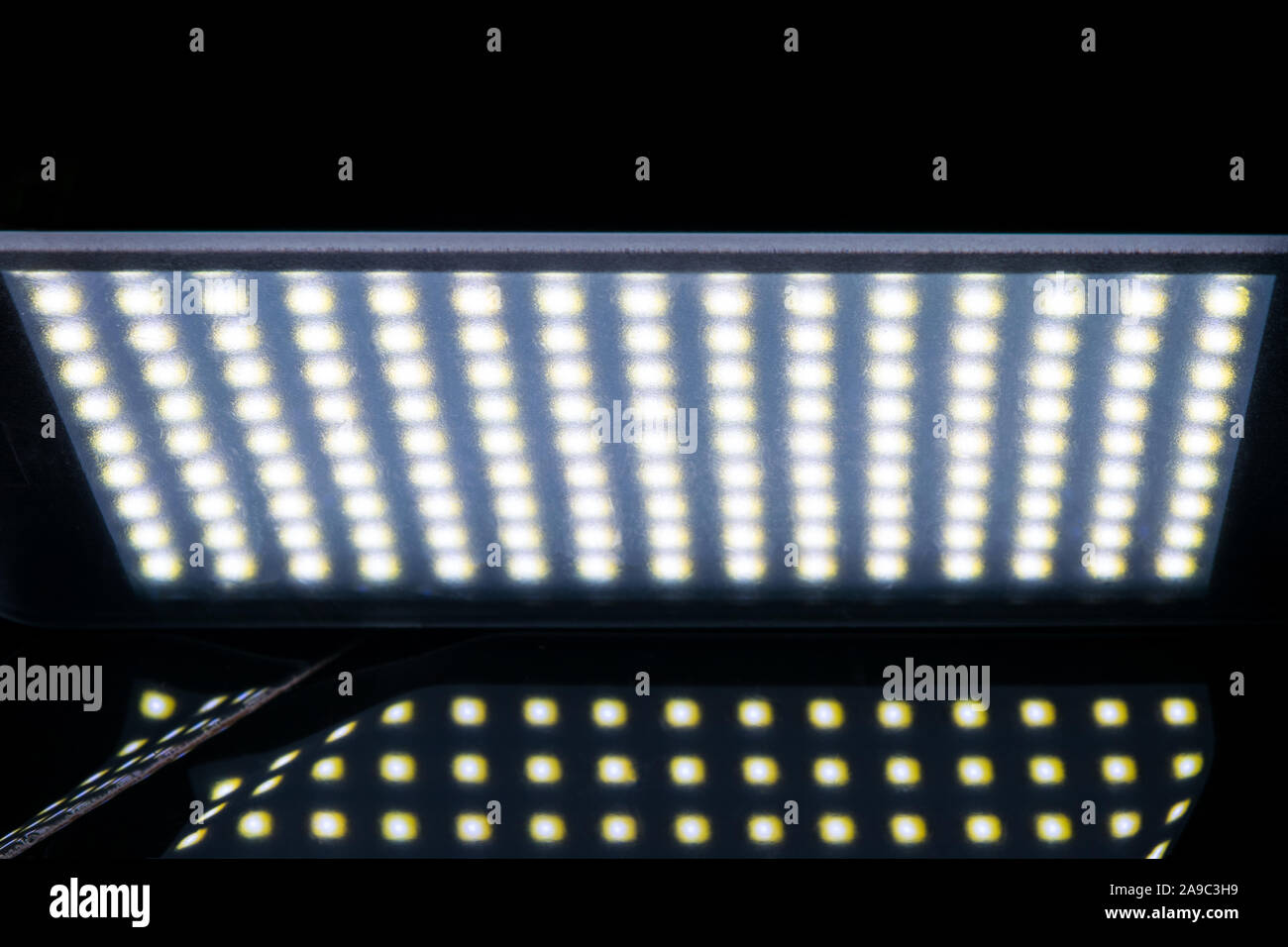 Many LED lights covered with scratched transparent matte filter reflect ...