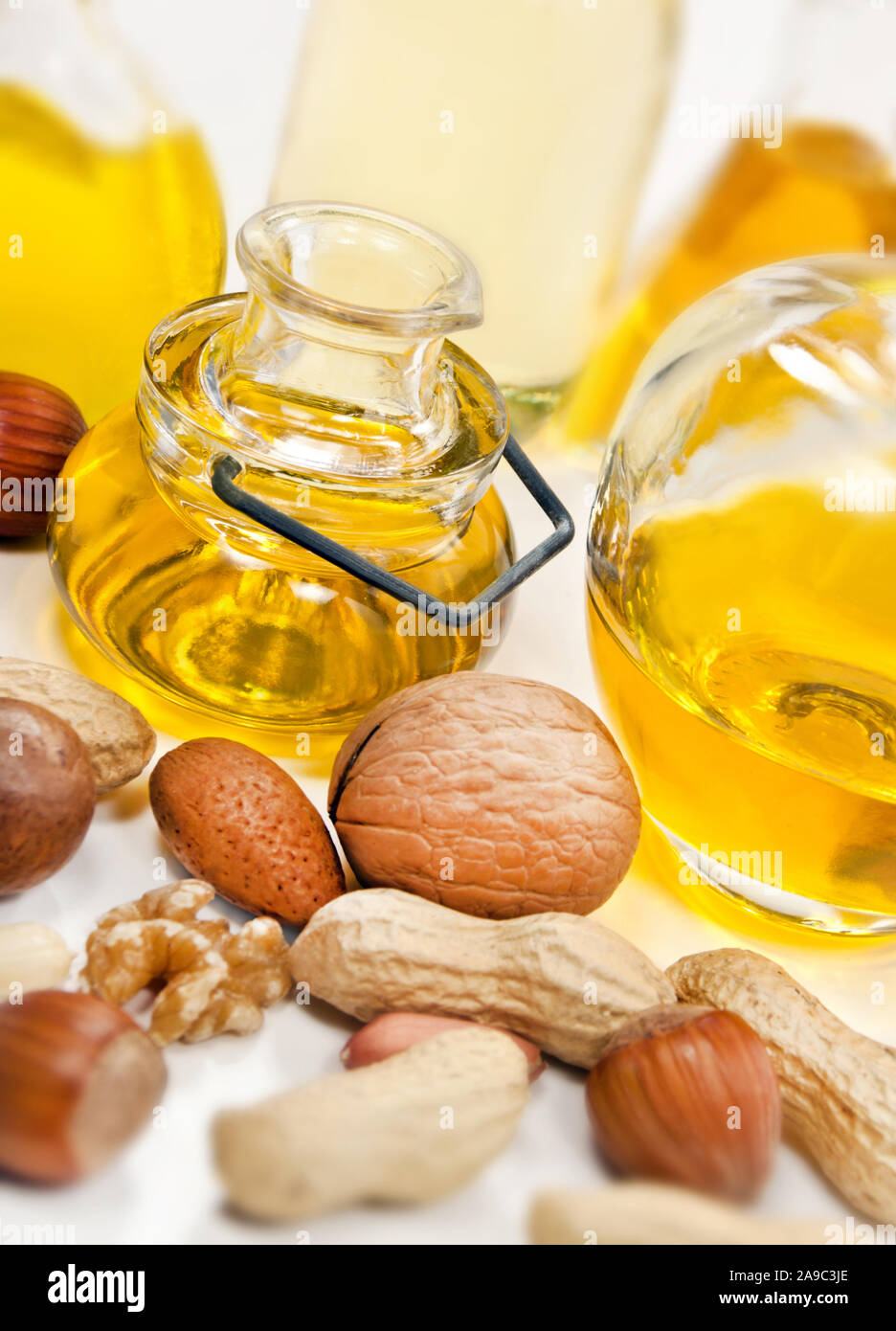 Various healthy oils an nuts Stock Photo - Alamy