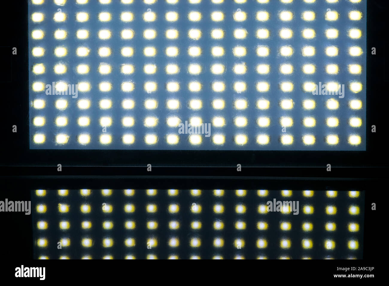 Many LED lights covered with scratched transparent matte filter reflect ...