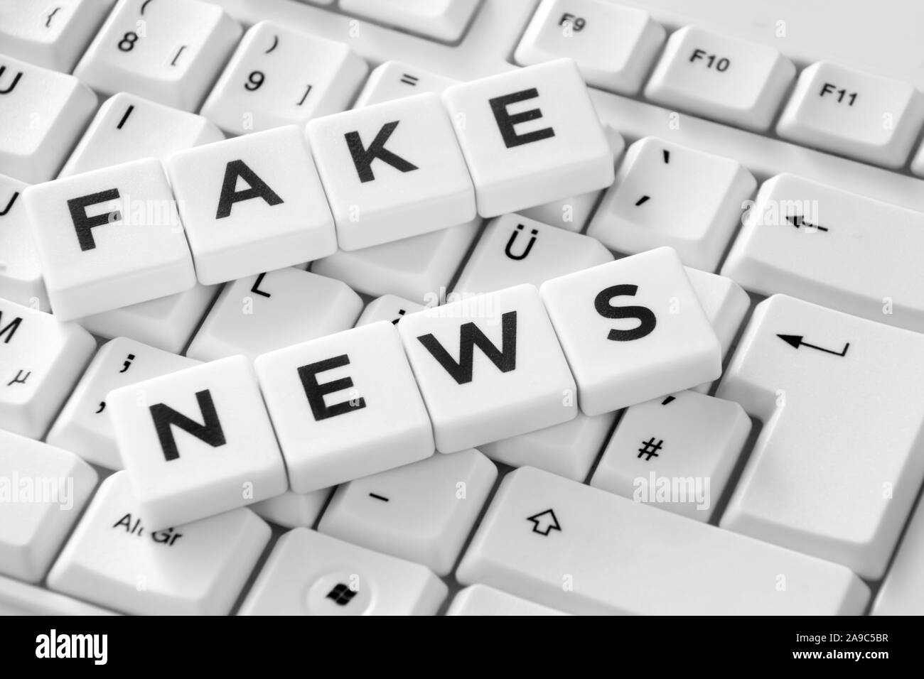 Fake News and keyboard background Stock Photo - Alamy