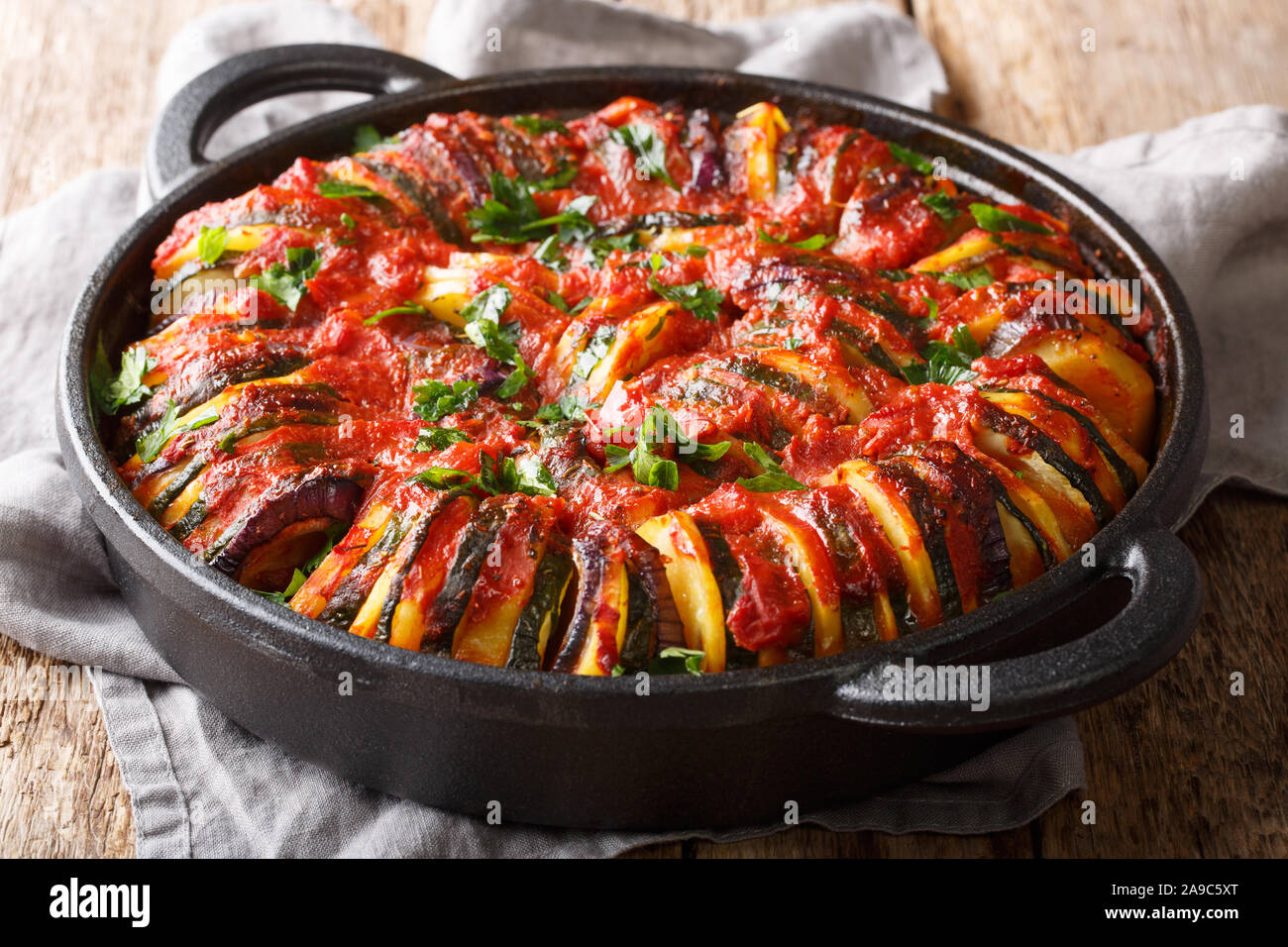 Traditional Greek briam made of vegetables close-up in a pan on the ...