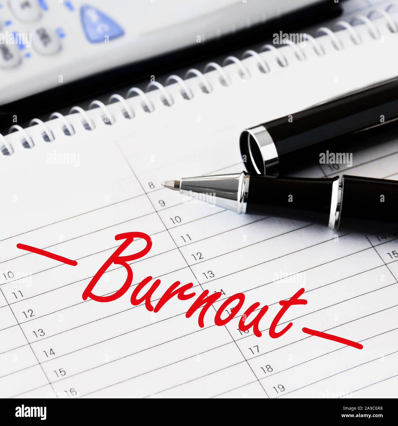 Burnout and calendar background with pen Stock Photo - Alamy