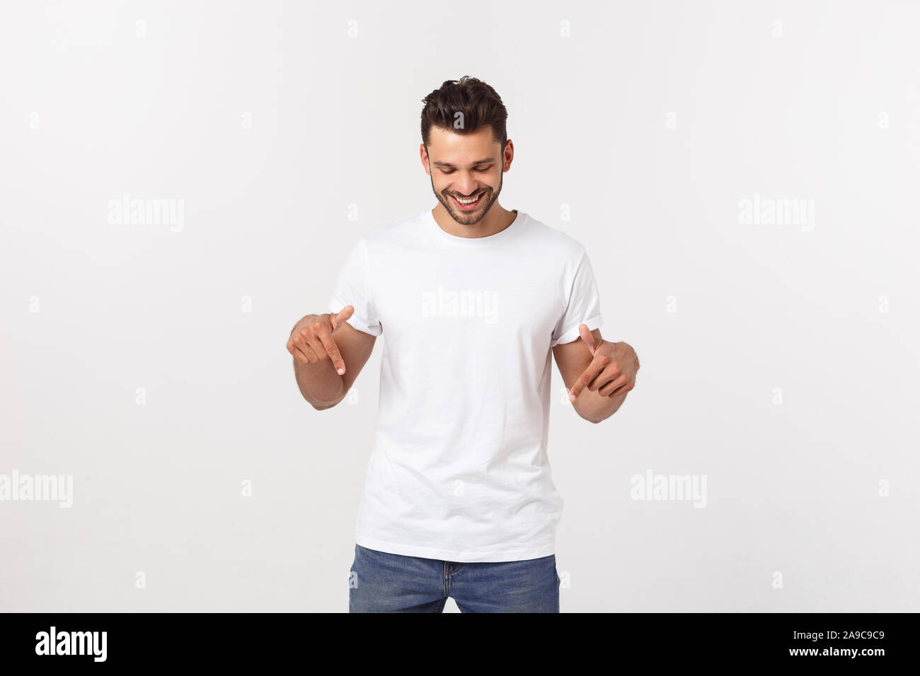 Man pointing showing copy space isolated on white background. Casual ...