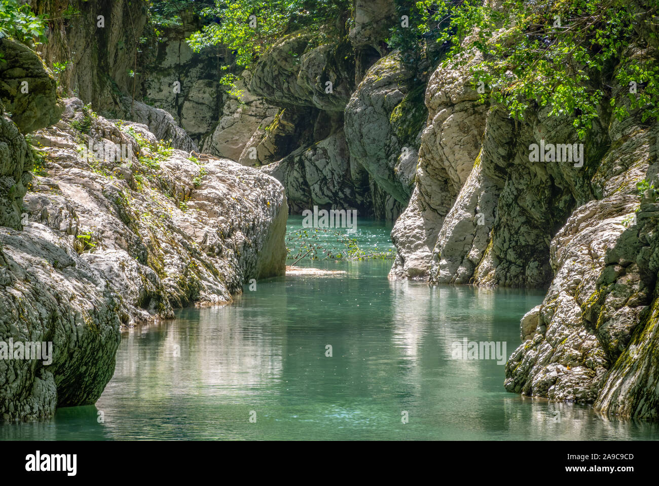 Transparent clear mountain river in a stone gorge. Mountain river with ...