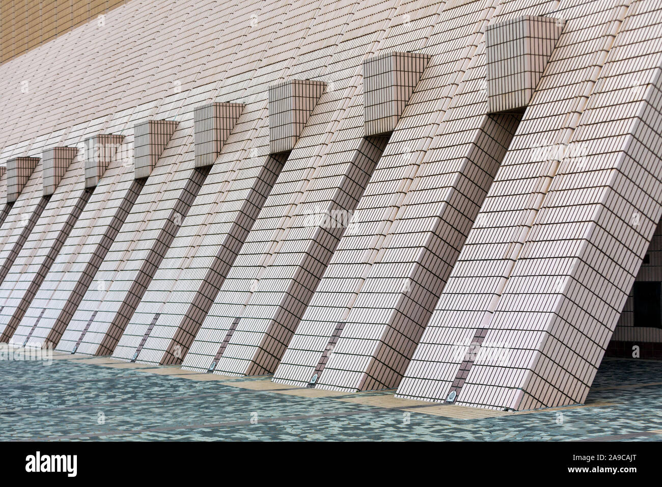 Modern Building Architecture With Yellow Tiles Wall Stock Photo - Alamy