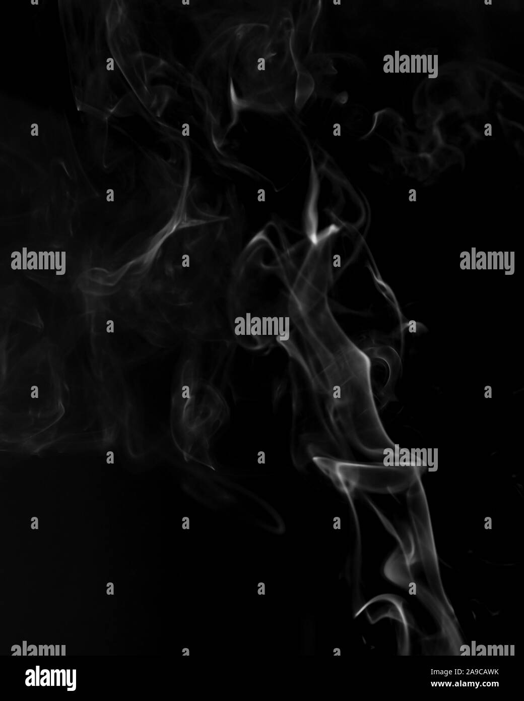 Gray smoke on a black background. Realistic incense smoke captured with ...