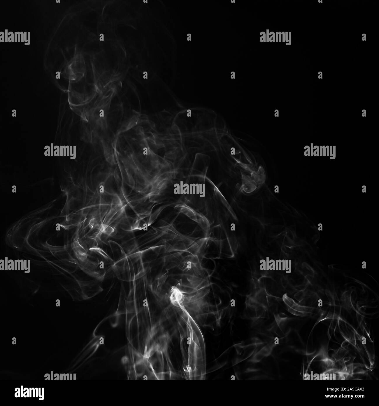 Gray smoke on a black background. Realistic incense smoke captured with ...