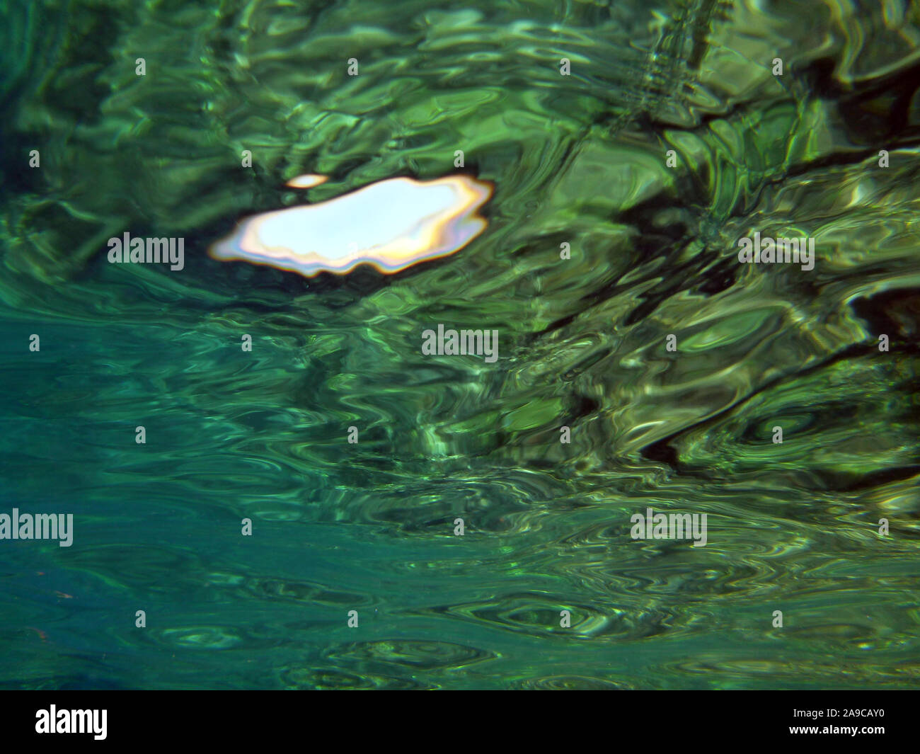 Abstract image showing reflections on sea surface shot from below Stock ...