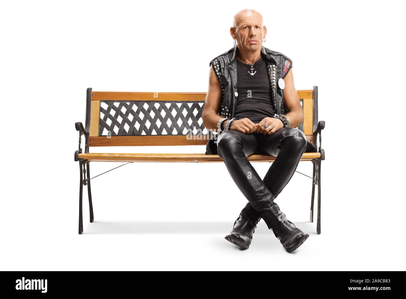 Serious punker sitting on a bench isolated on white background Stock ...