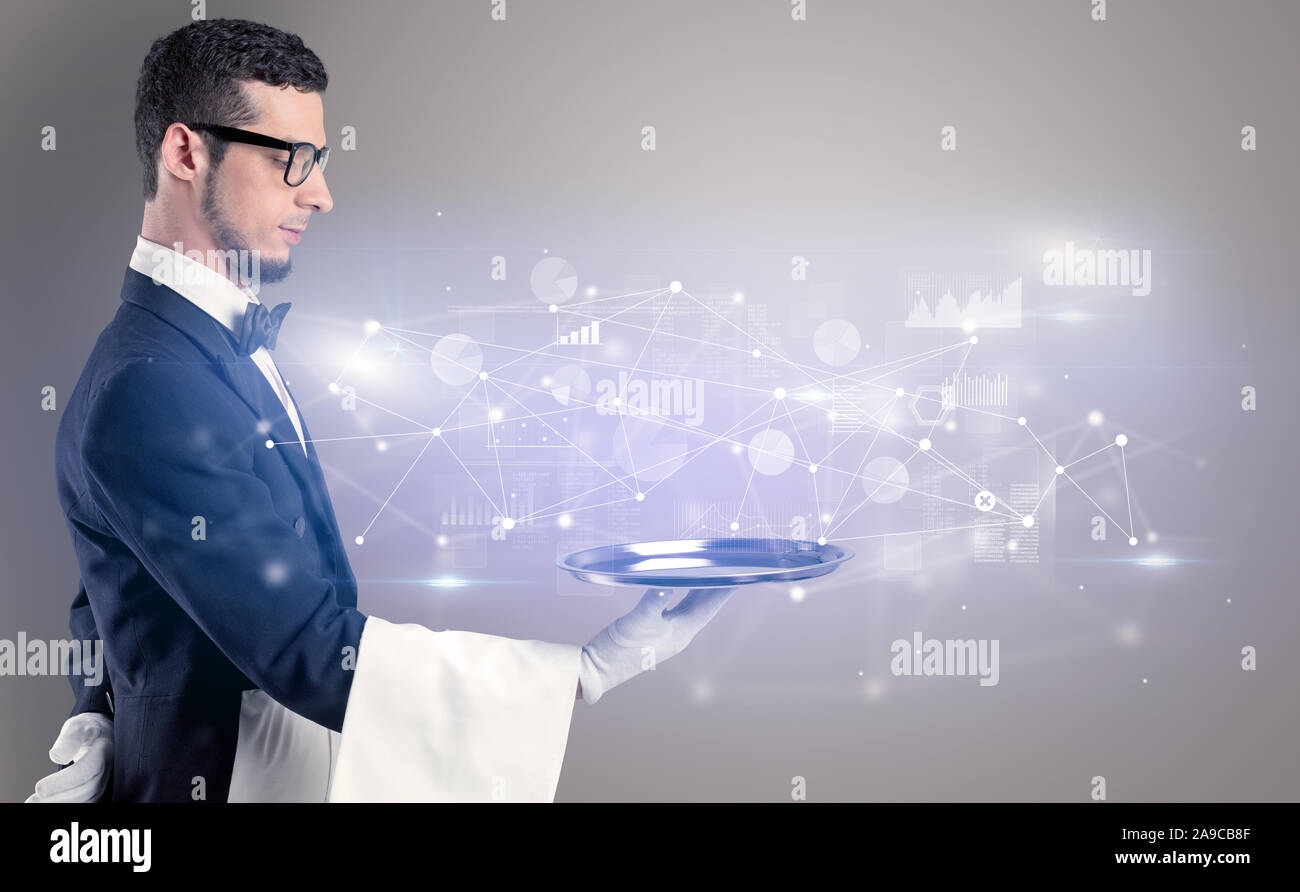 Young waiter serving financial concept on a metal tray Stock Photo - Alamy