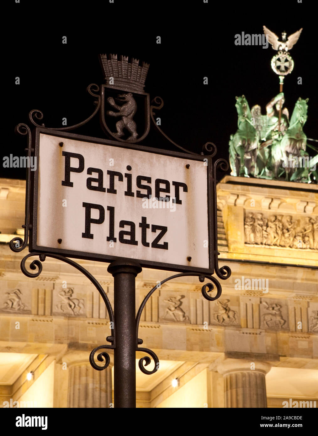 A Pariser Platz street sign with the iconic Brandenburg Gate pictured ...