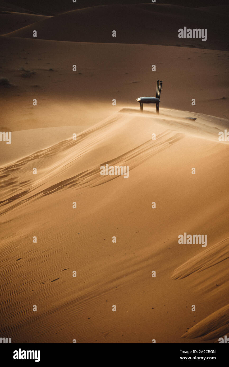 Chair over dune in Sahara desert Stock Photo - Alamy
