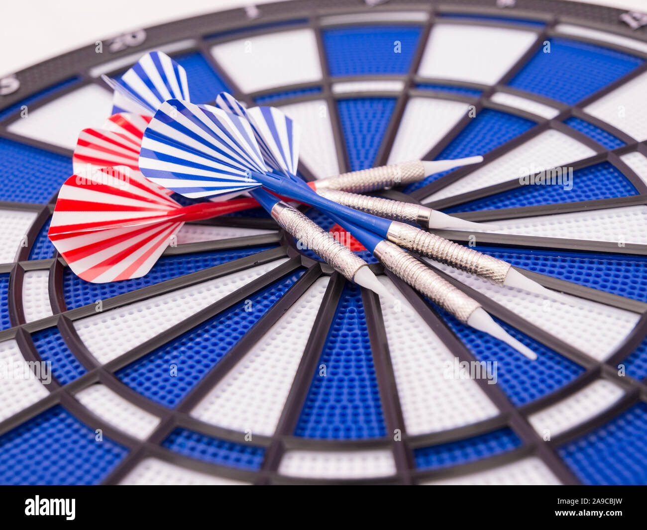 dartboard with red an blue darts. close-up, selective focus Stock Photo ...