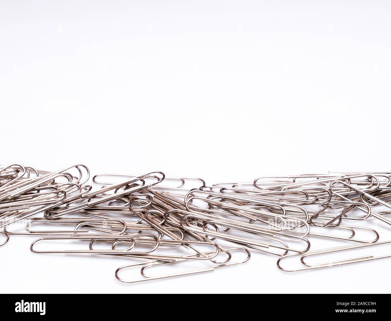 Group of metal clips isolated in white background with space for text ...