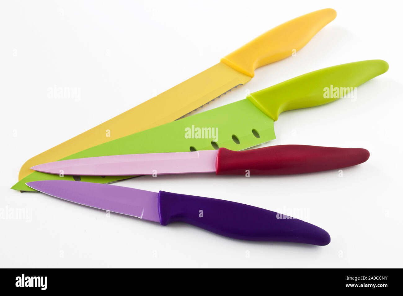 Various colorful kitchen knives on white background Stock Photo - Alamy