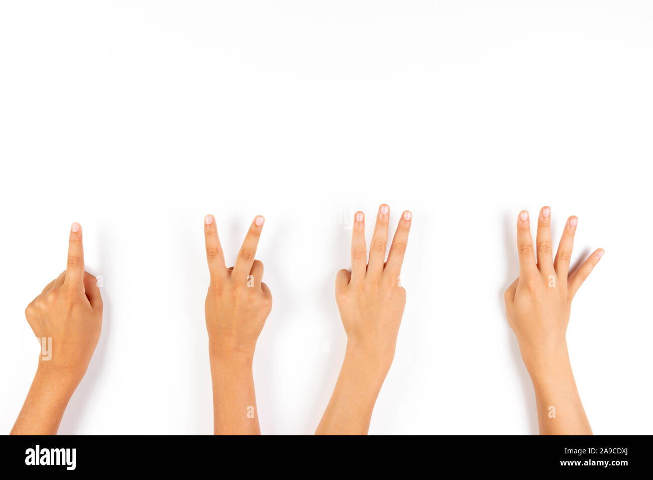 Kid hands pointing down with fingers to something on white background ...