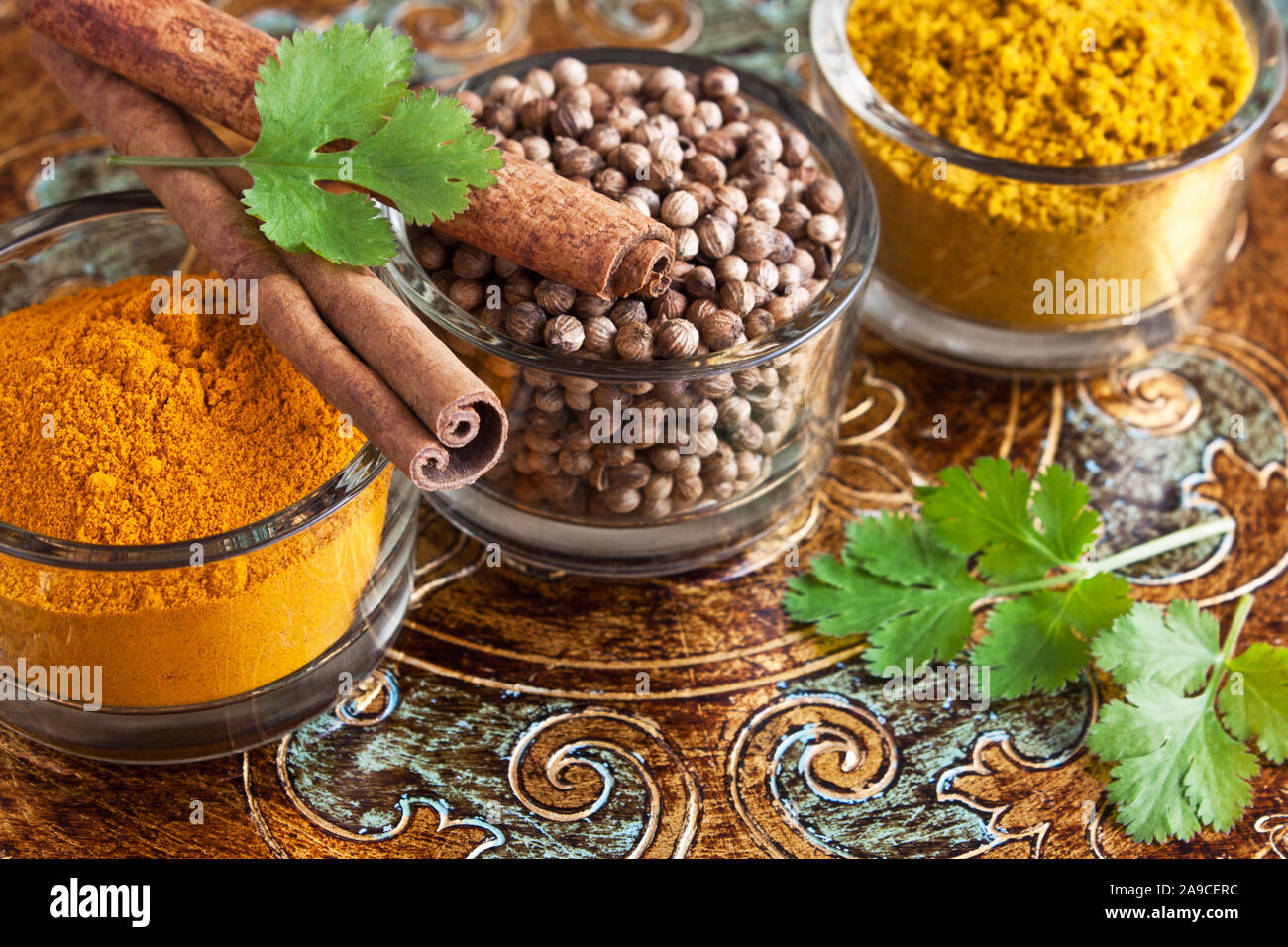 Spices curcuma, curry and coriander Stock Photo - Alamy