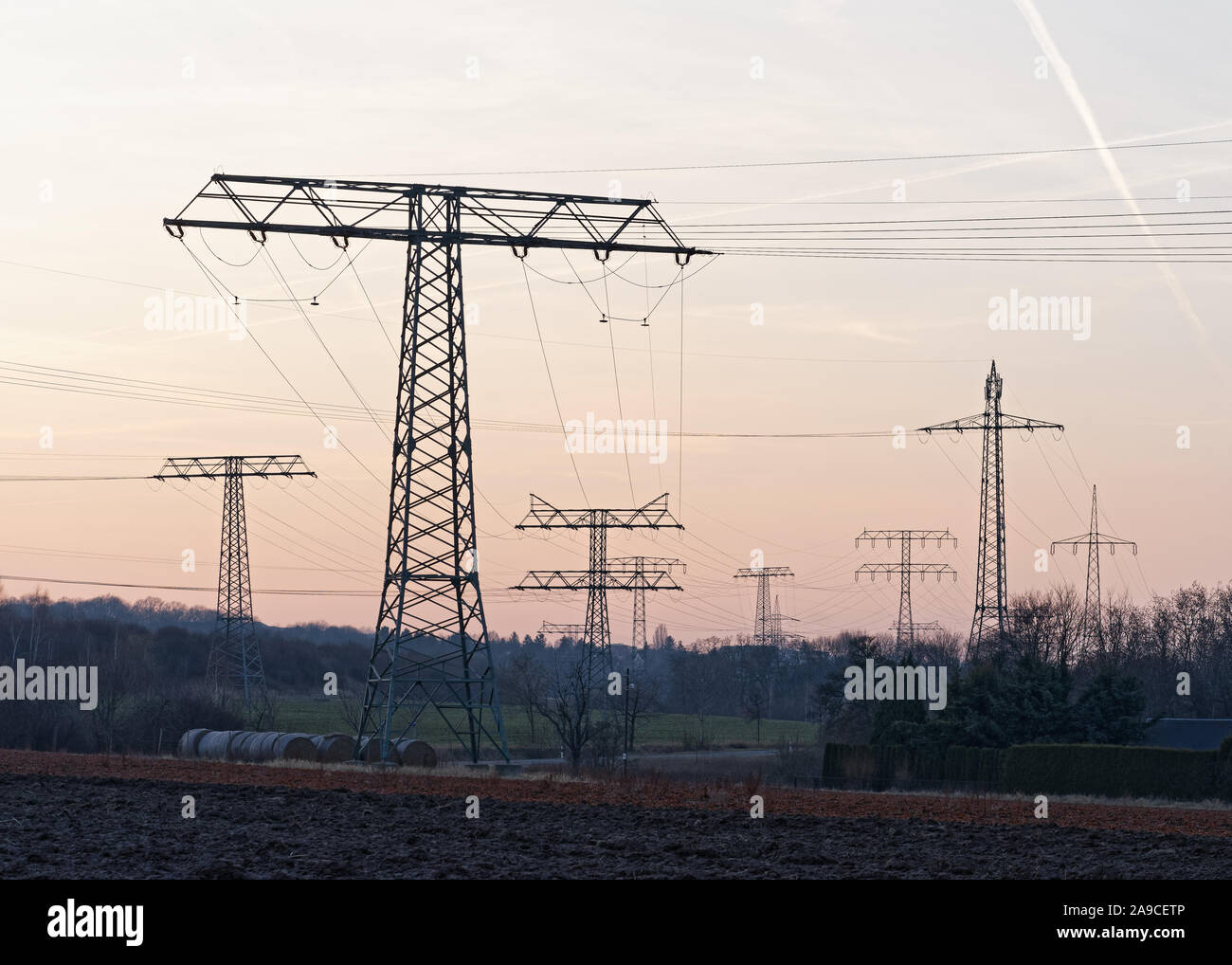 Large collection of electricity pylons with cables, they are staggered ...