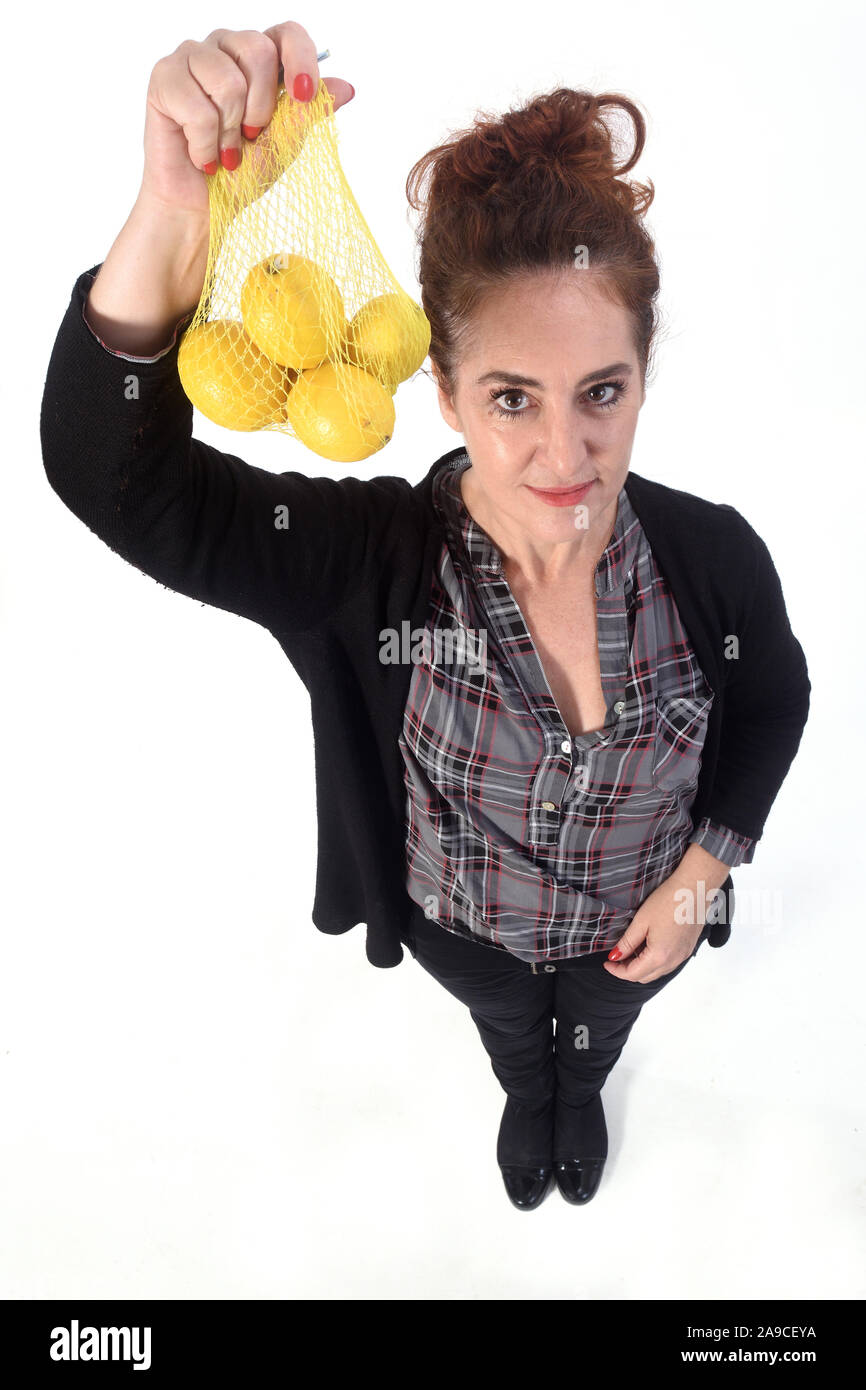 woman with lemon on white background Stock Photo - Alamy
