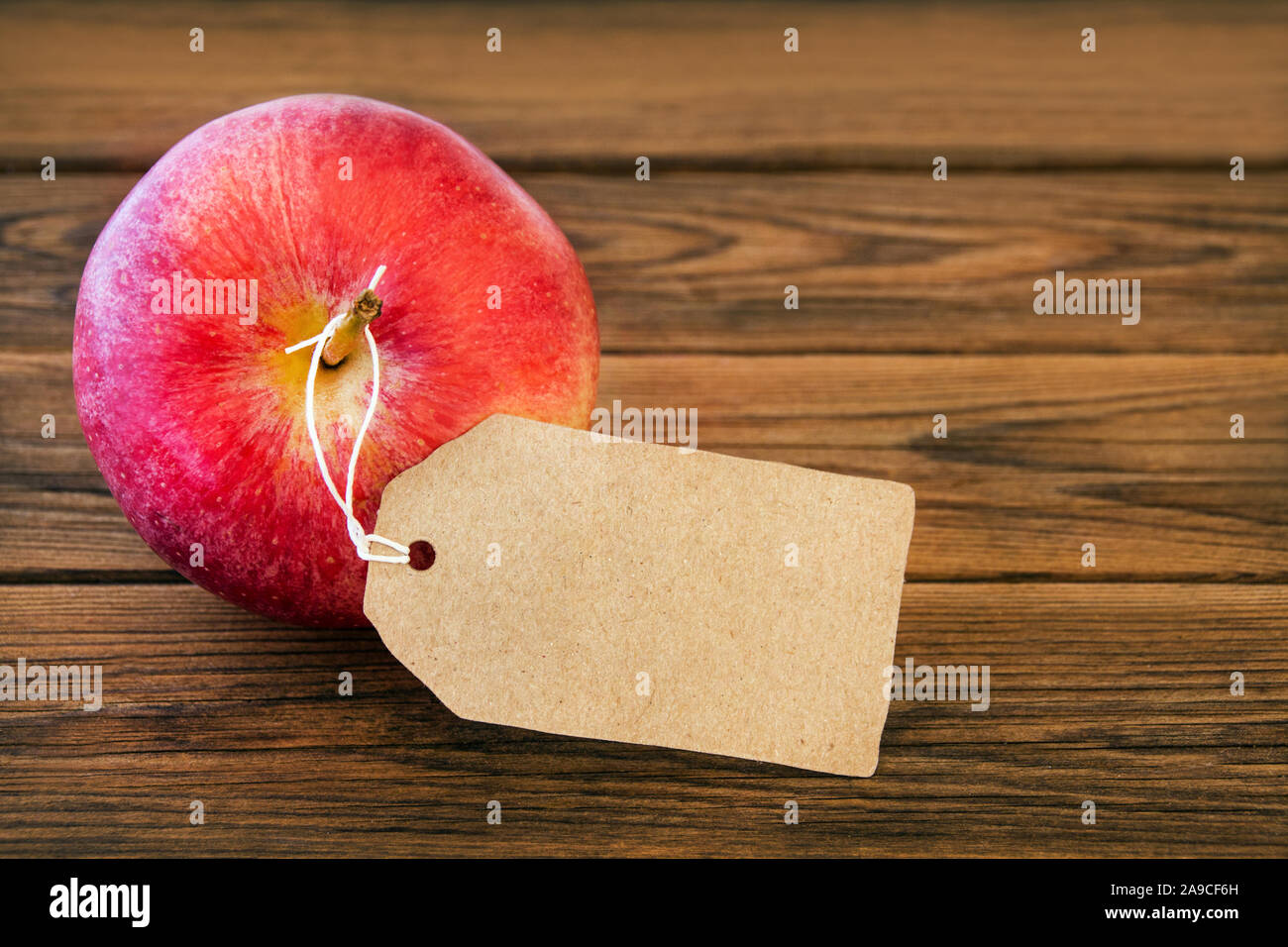 Red apple and label background Stock Photo - Alamy