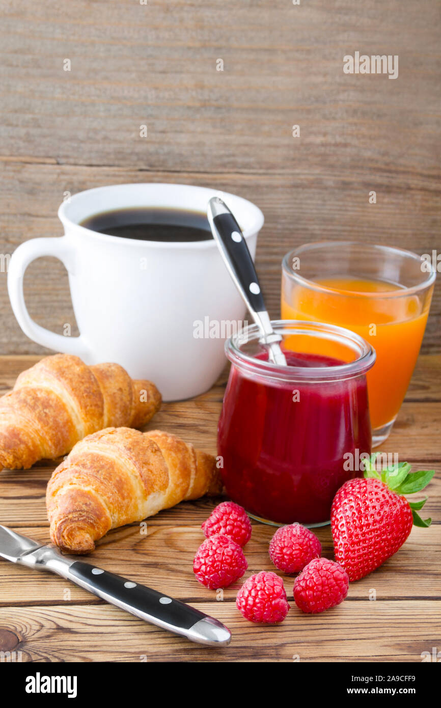 Breakfast table with bread, fruits and coffee Stock Photo - Alamy
