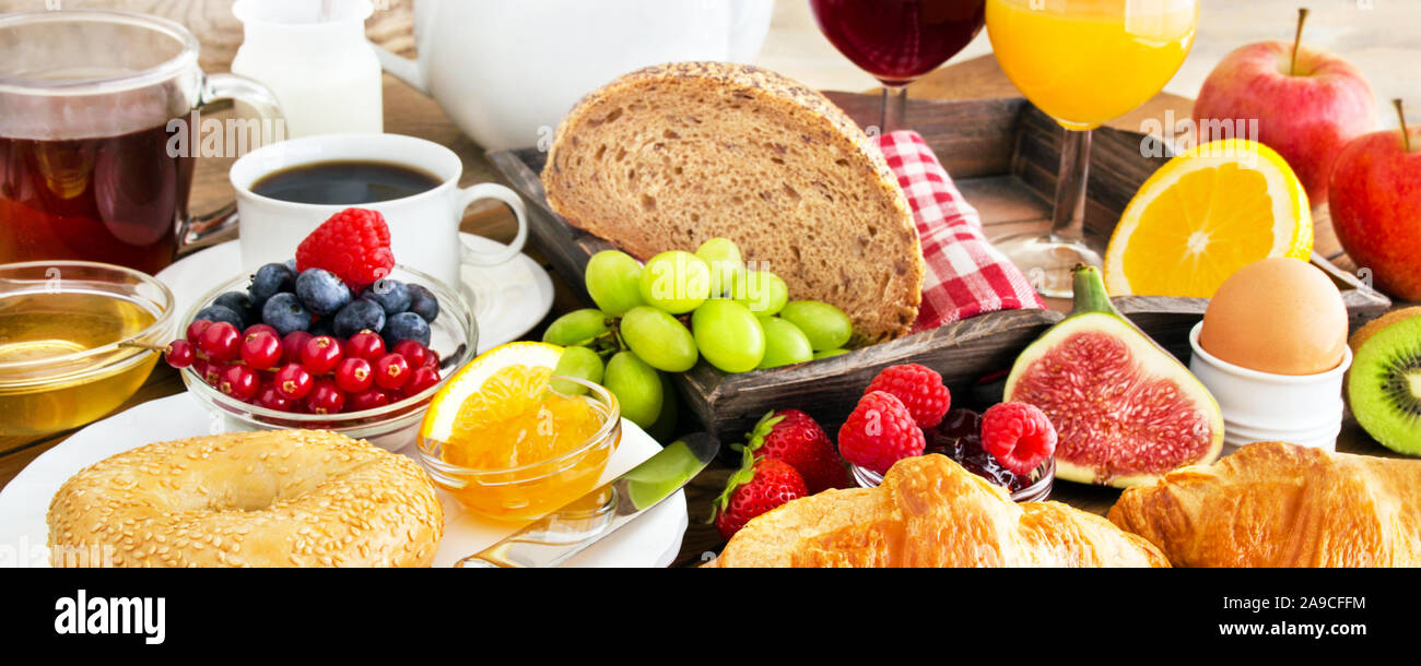 Breakfast table with bread, fruits and coffee Stock Photo - Alamy