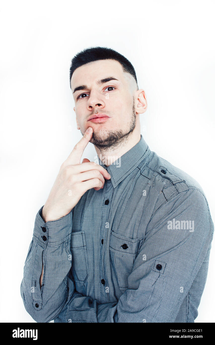 young handsome well groomed guy posing on white background gesturing ...