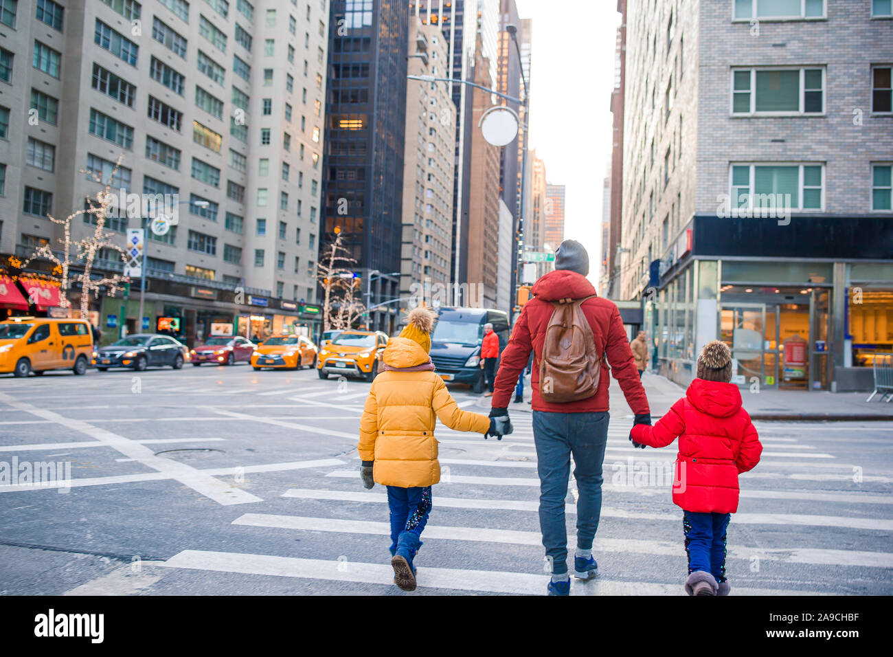 Family of father and his little kids walk on Manhattan in New York City ...
