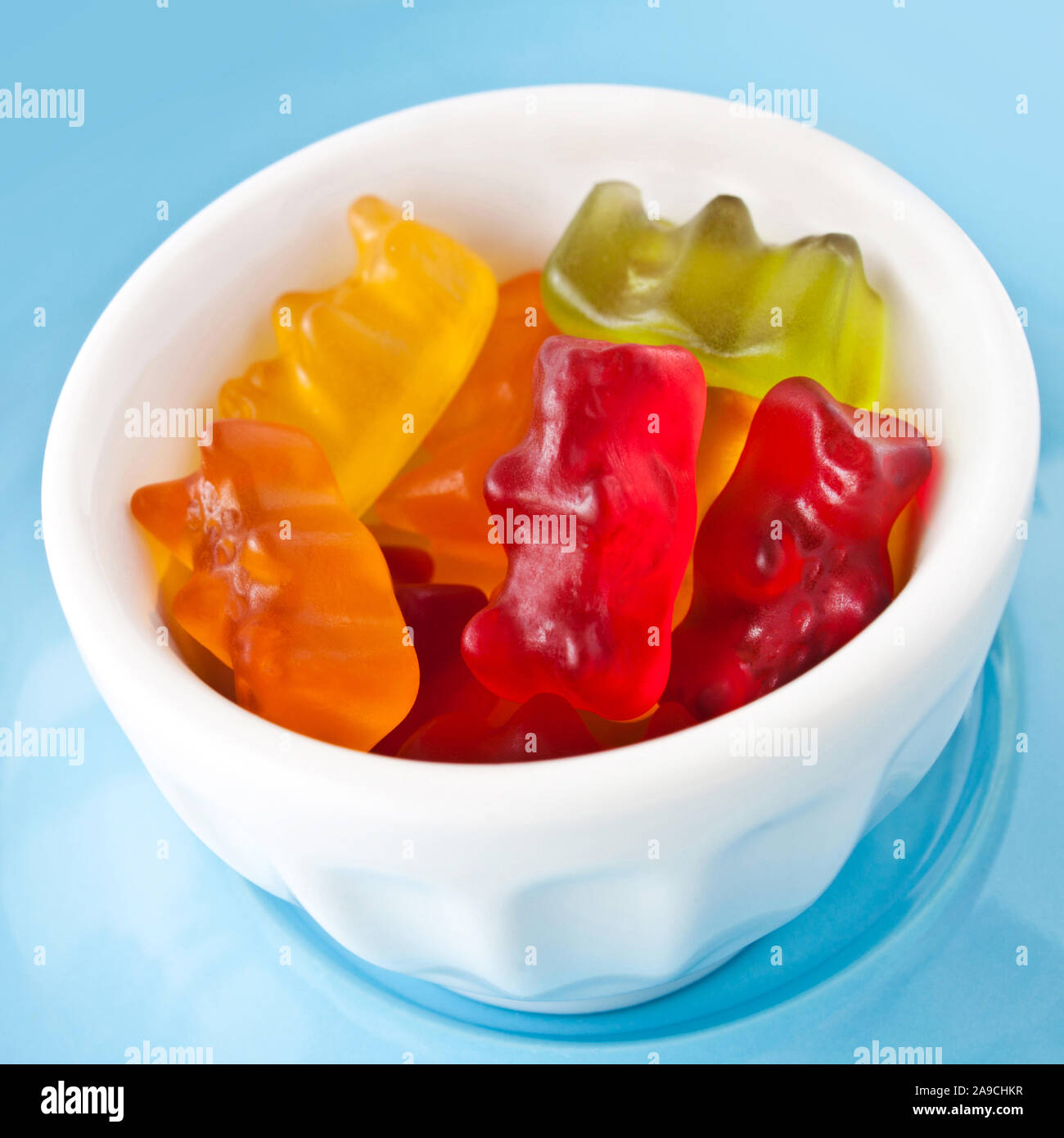 Gummy bears in white bowl Stock Photo - Alamy