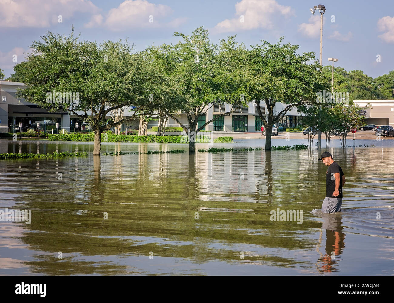 Man wading through water in hi-res stock photography and images - Alamy