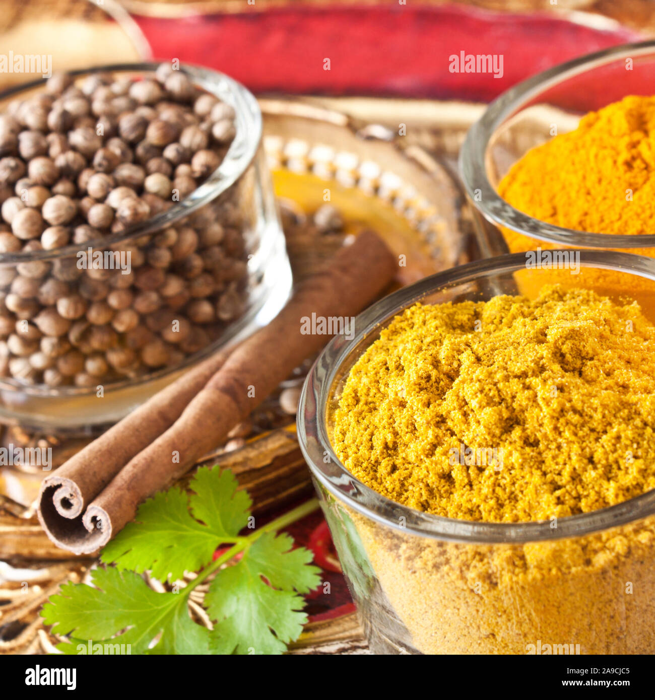 Spices curcuma, curry and coriander Stock Photo - Alamy