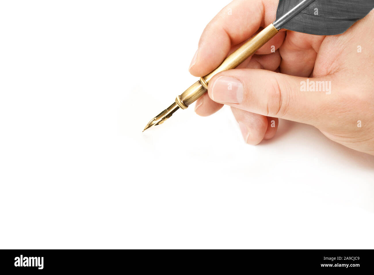 Feather pen and male hand Stock Photo - Alamy