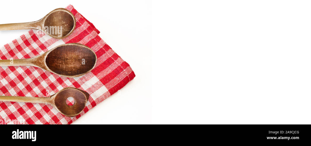 Wooden cooking spoons and white background Stock Photo - Alamy