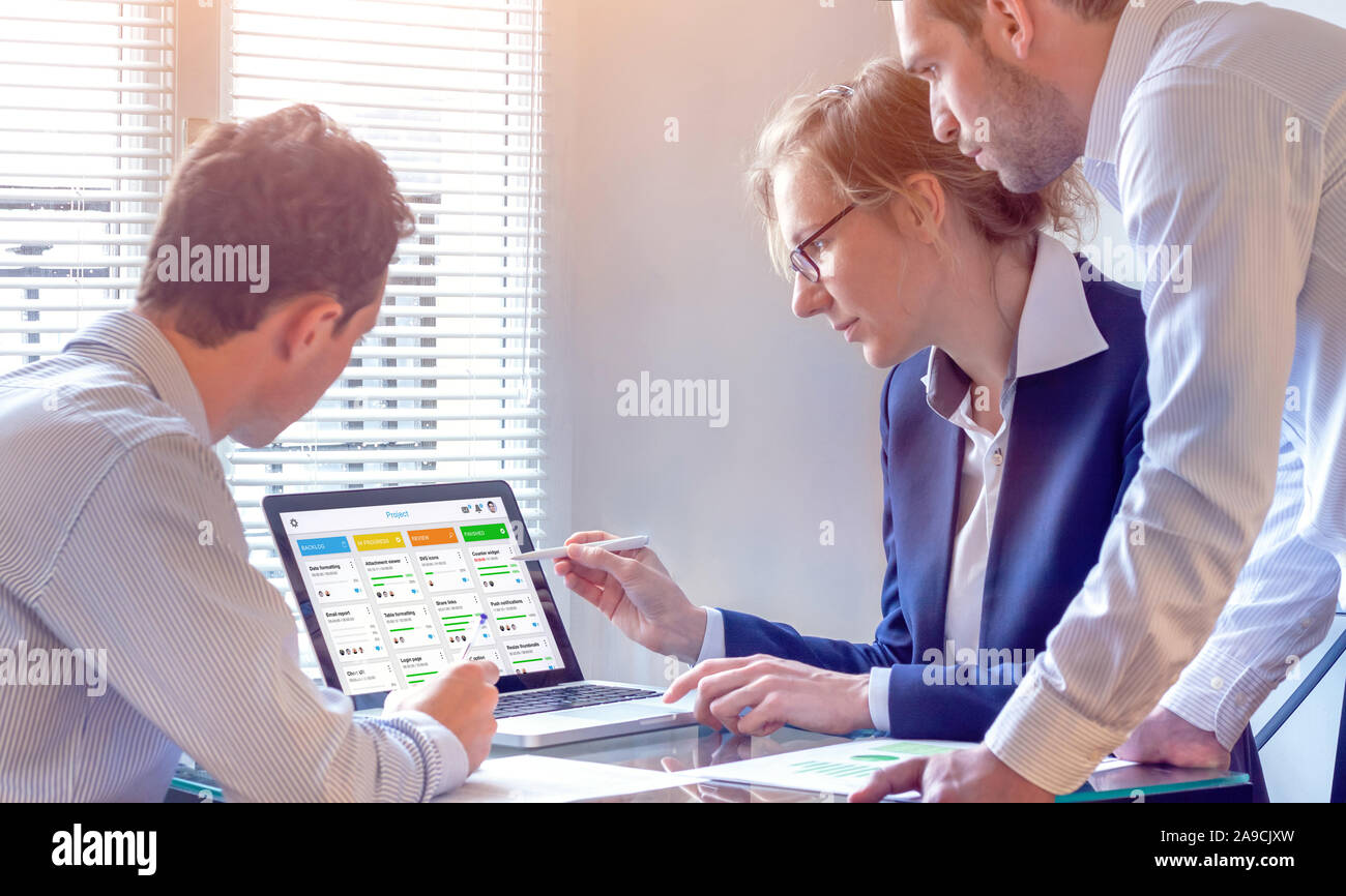 Daily team meeting around agile product development board with scrum or ...