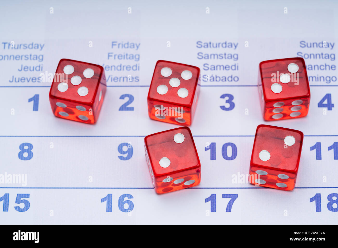 An Overhead View Of Transparent Red Dice With White Dots On Calendar's ...