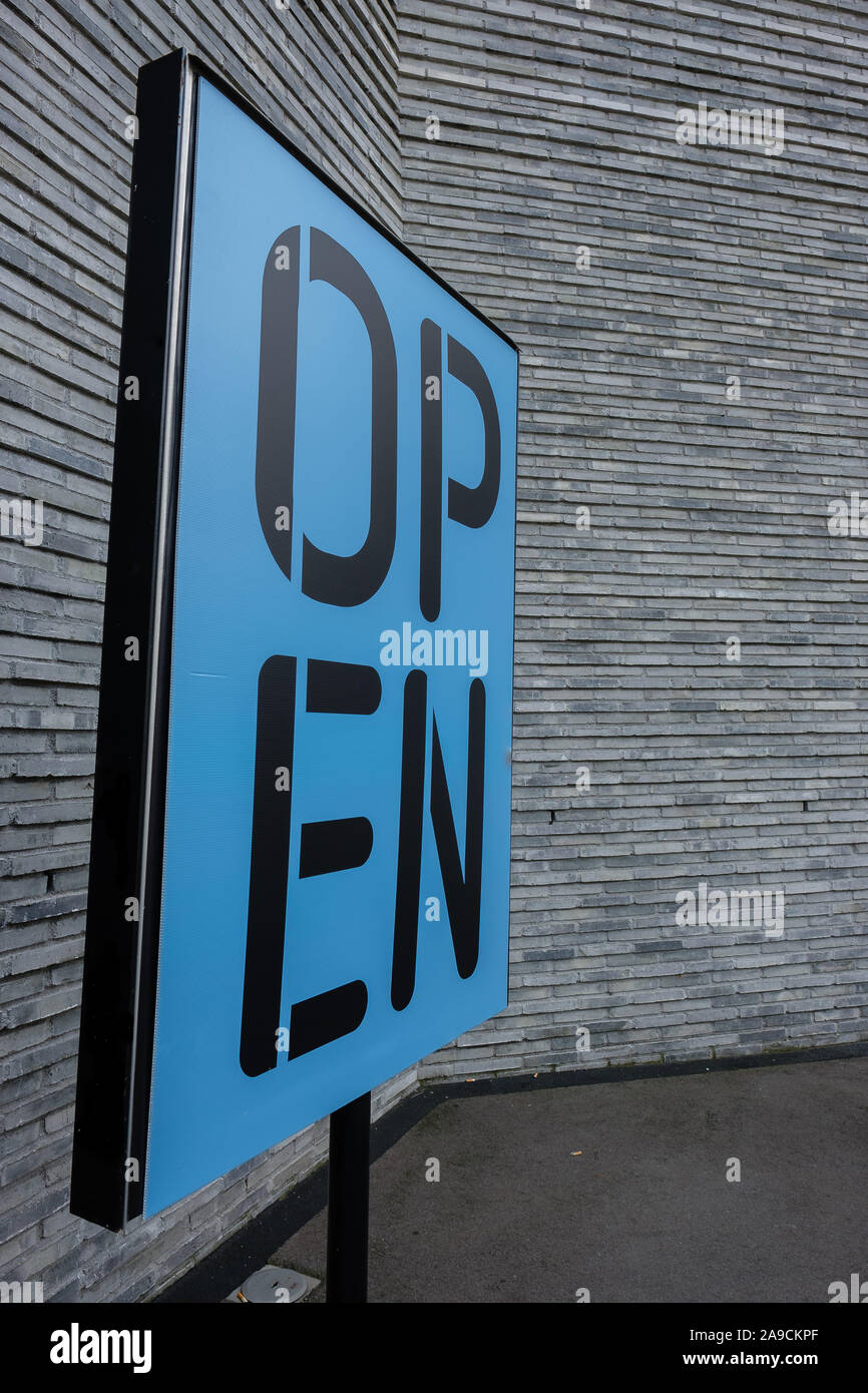 The open sign and the stone wall Stock Photo - Alamy