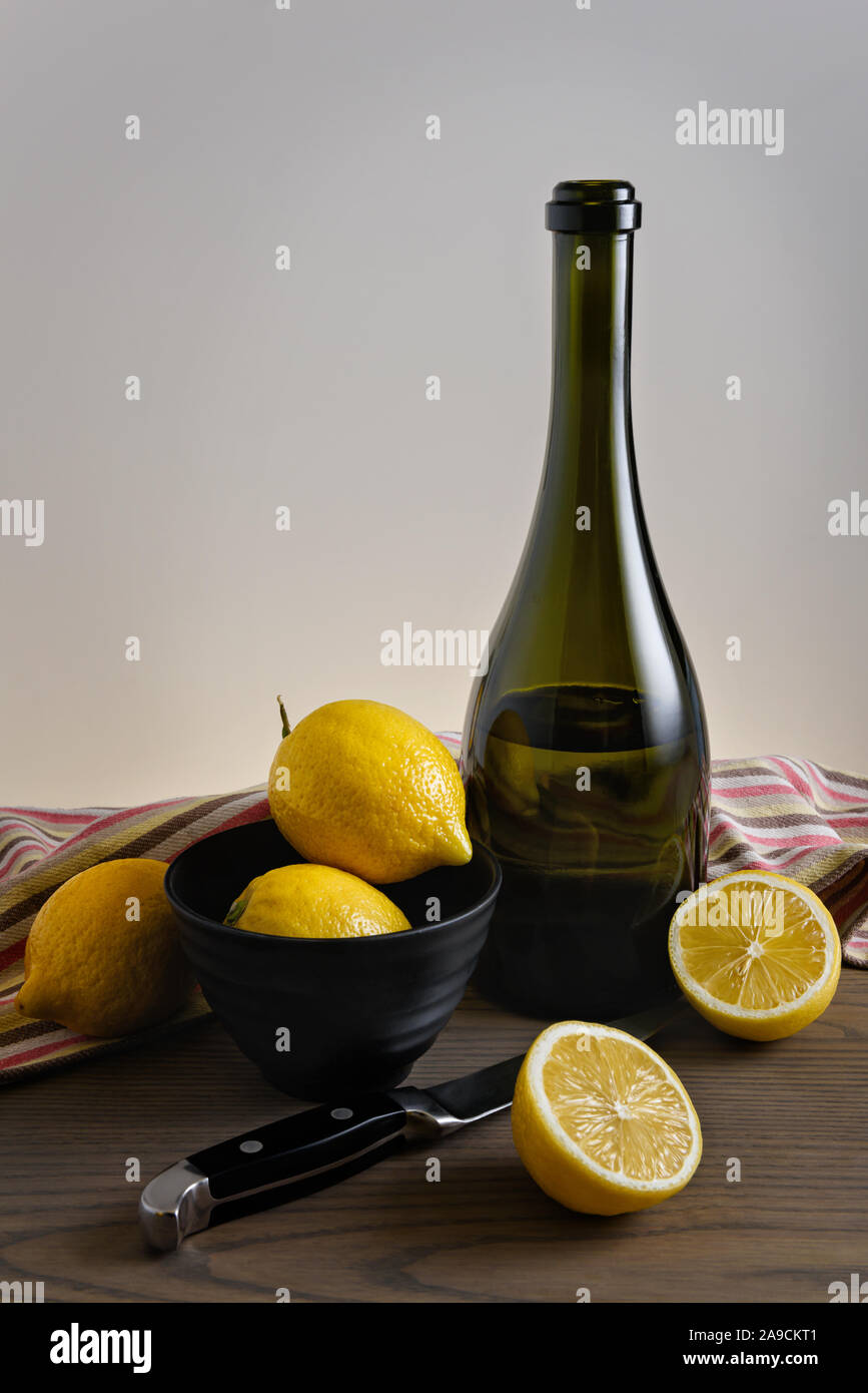 Lemons and bottle with lemonade on the table Stock Photo - Alamy