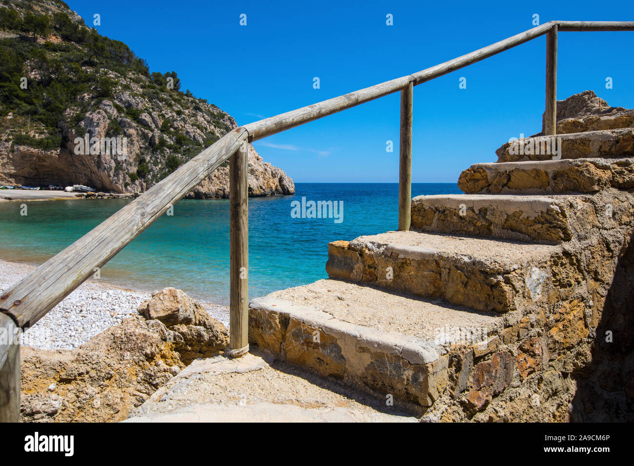 Stone Steps on the stunning La Granadella beach in Javea, Spain Stock ...