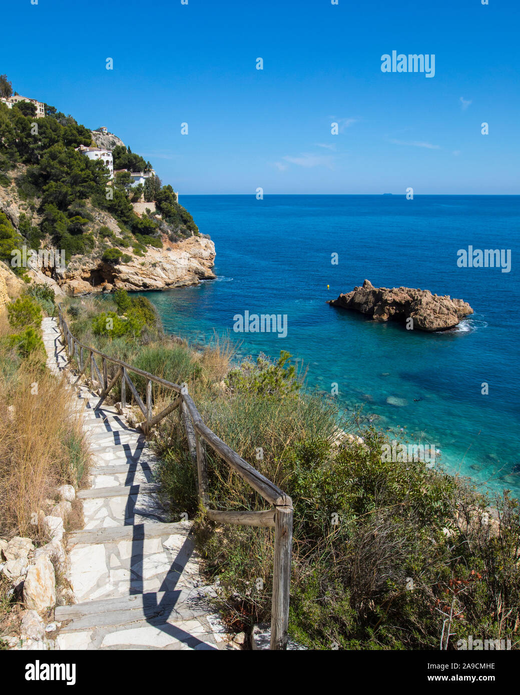 Steps leading down to the stunning Ambolo Beach in Javea, Spain Stock ...