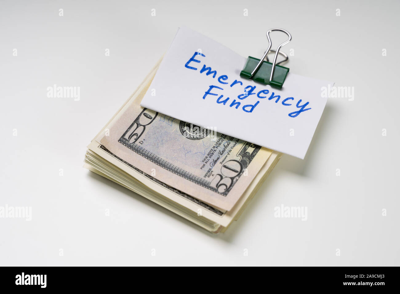 Emergency Fund Text On Card Over The Folded Bundle Of 50 Dollar Notes ...