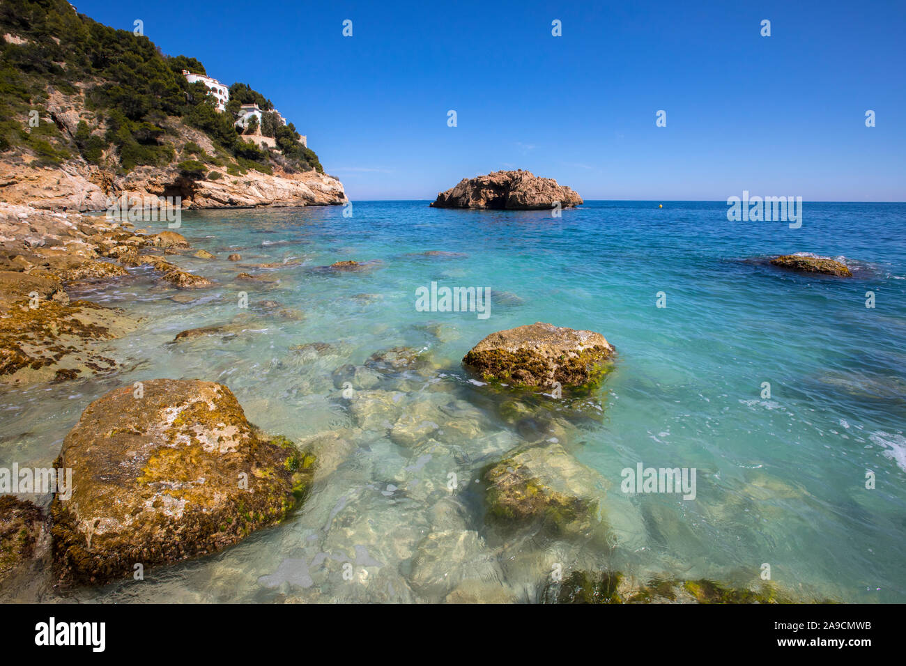 A view of the stunning Ambolo Beach in Javea, Spain Stock Photo - Alamy