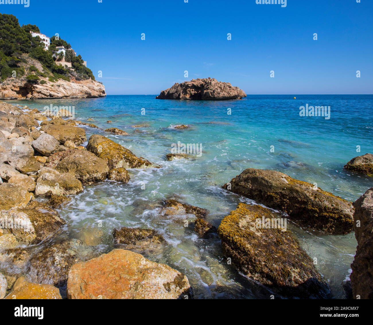 A view of the stunning Ambolo Beach in Javea, Spain Stock Photo - Alamy