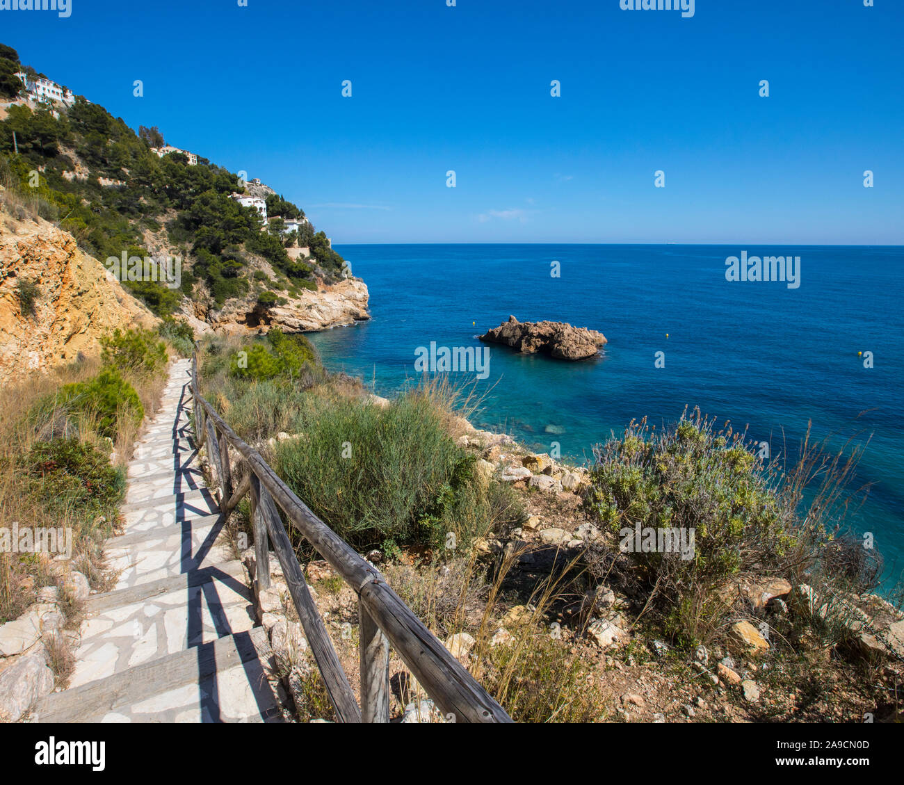Steps leading down to the stunning Ambolo Beach in Javea, Spain Stock ...